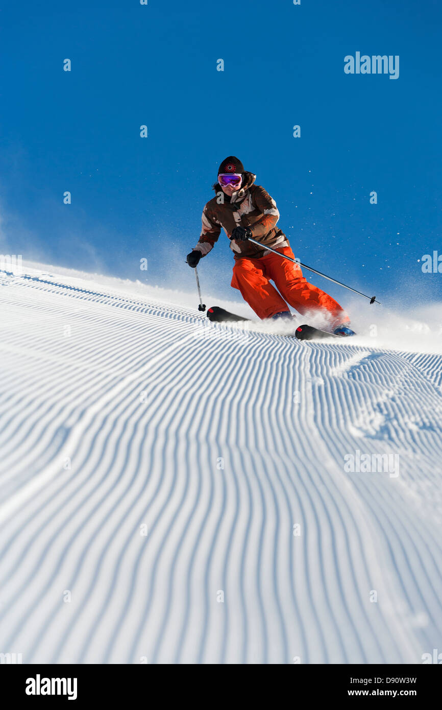 Skier going down slope Stock Photo - Alamy