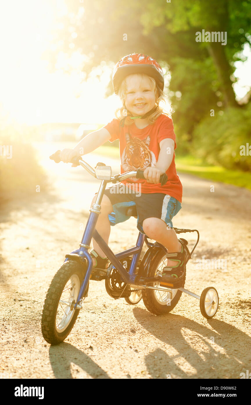 Boy riding bike Stock Photo - Alamy