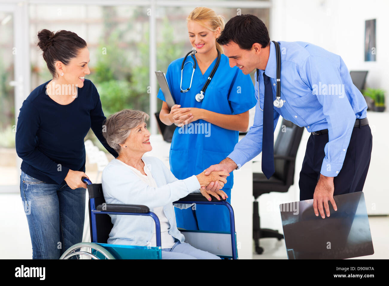 friendly male medical doctor greeting senior patient Stock Photo - Alamy