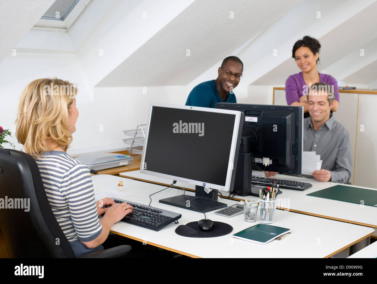 Coworkers together in office Stock Photo - Alamy