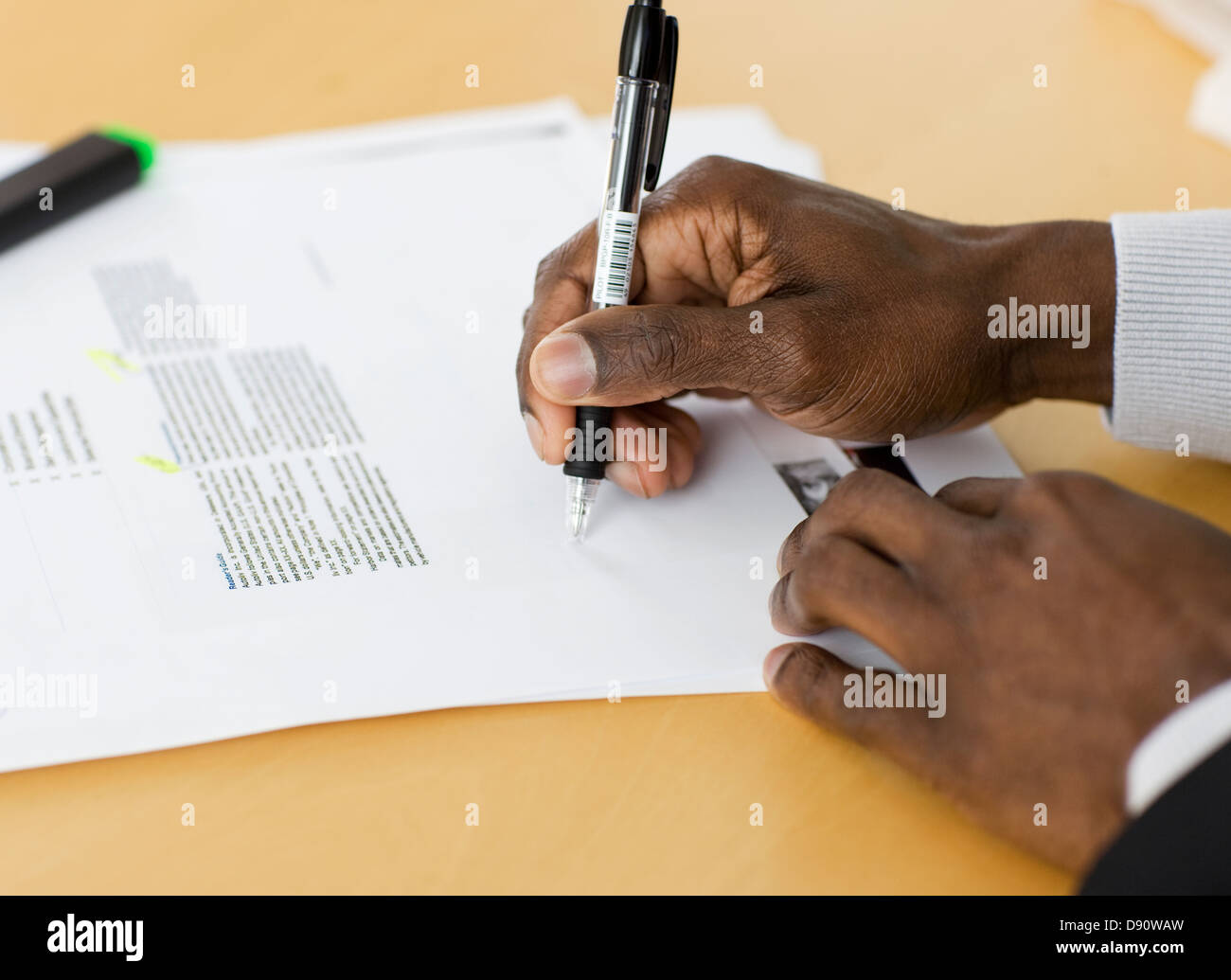 Hands writing notes on document, close-up Stock Photo - Alamy