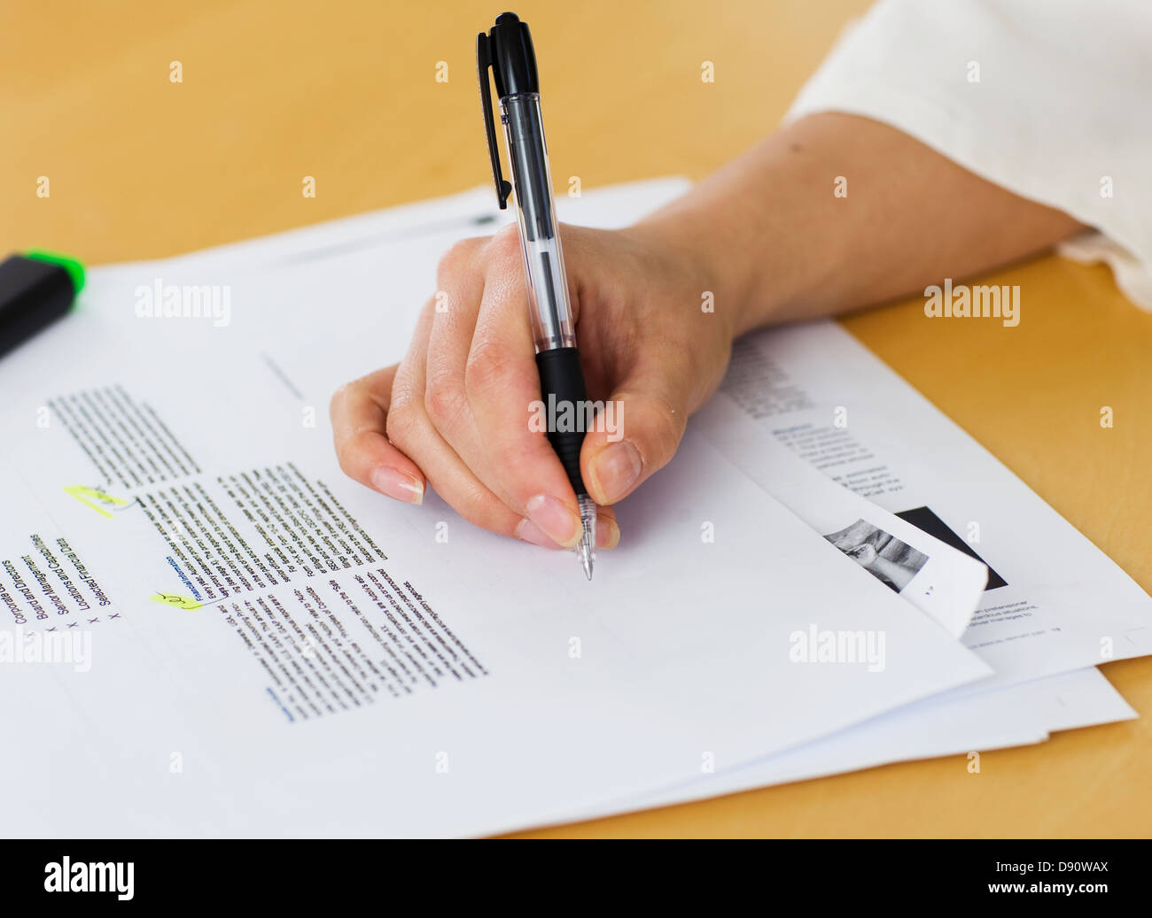Hands writing notes on document, close-up Stock Photo - Alamy