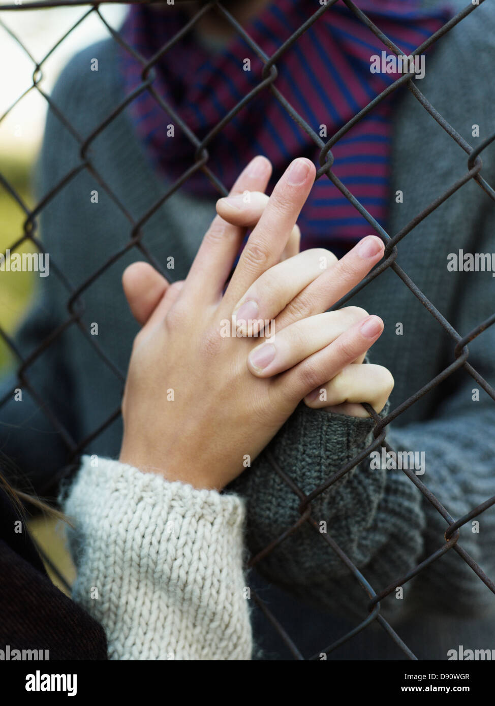 Hands through wire hi-res stock photography and images - Alamy