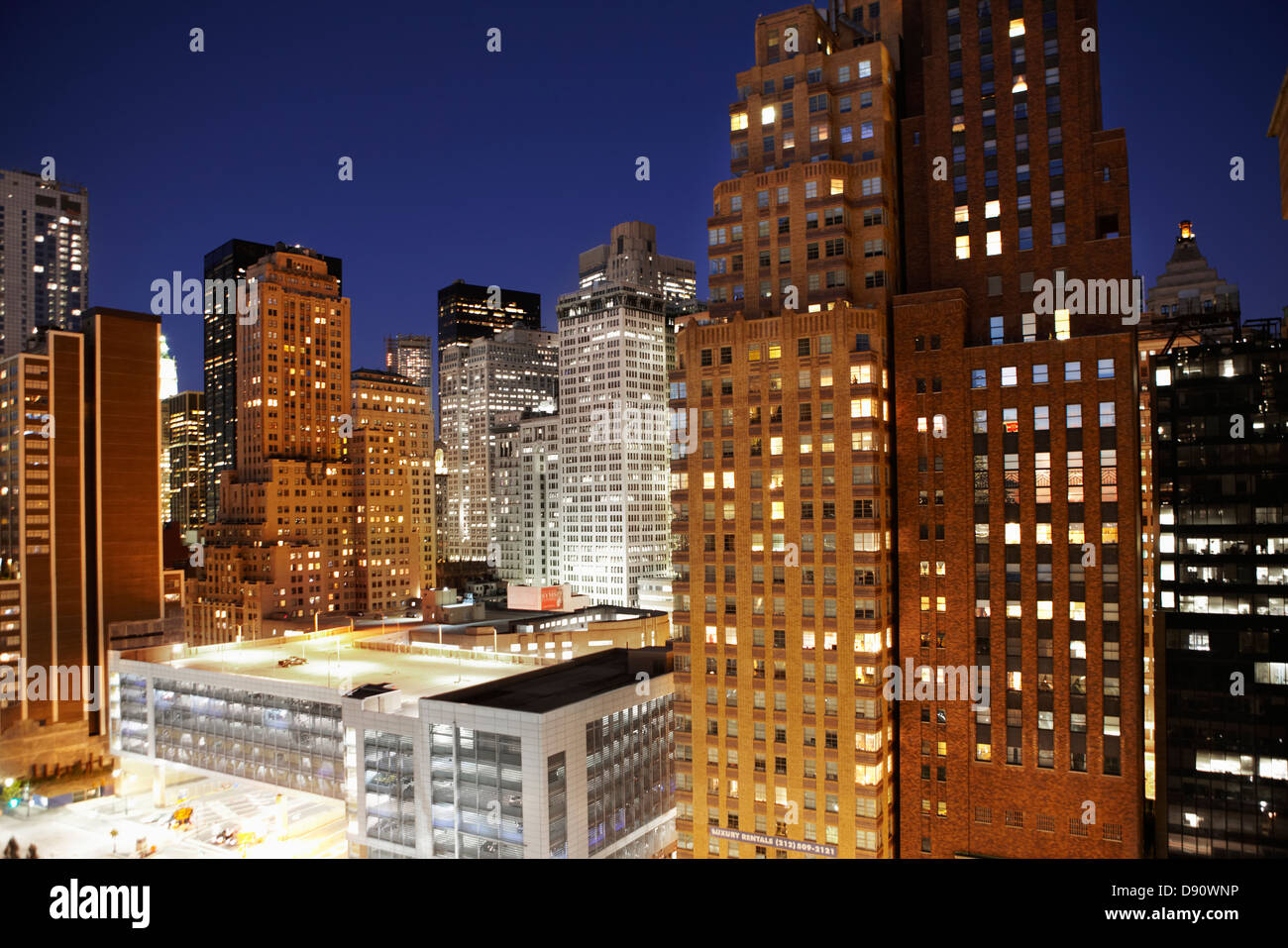 Manhattan buildings at night Stock Photo - Alamy