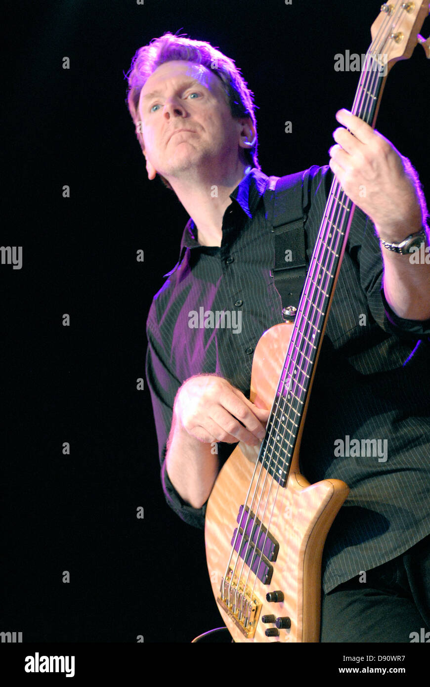 Tom Kennedy - American bass player on stage with Mike Stern during ...