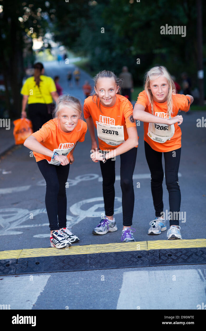 Smiling girls on start line Stock Photo - Alamy