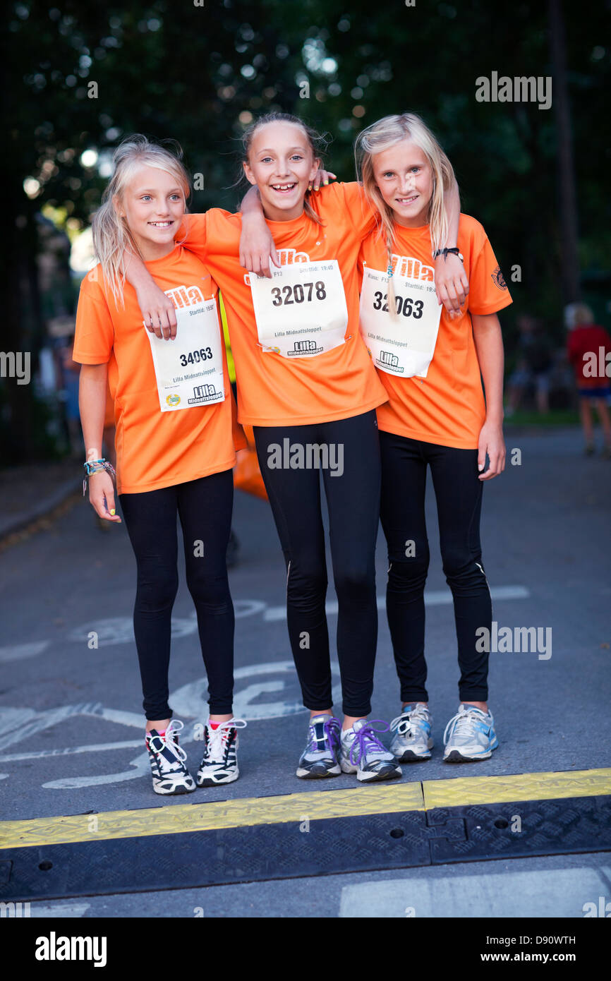 Smiling girls on start line Stock Photo - Alamy