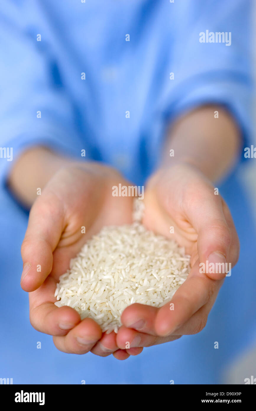 Hands rice hi-res stock photography and images - Alamy