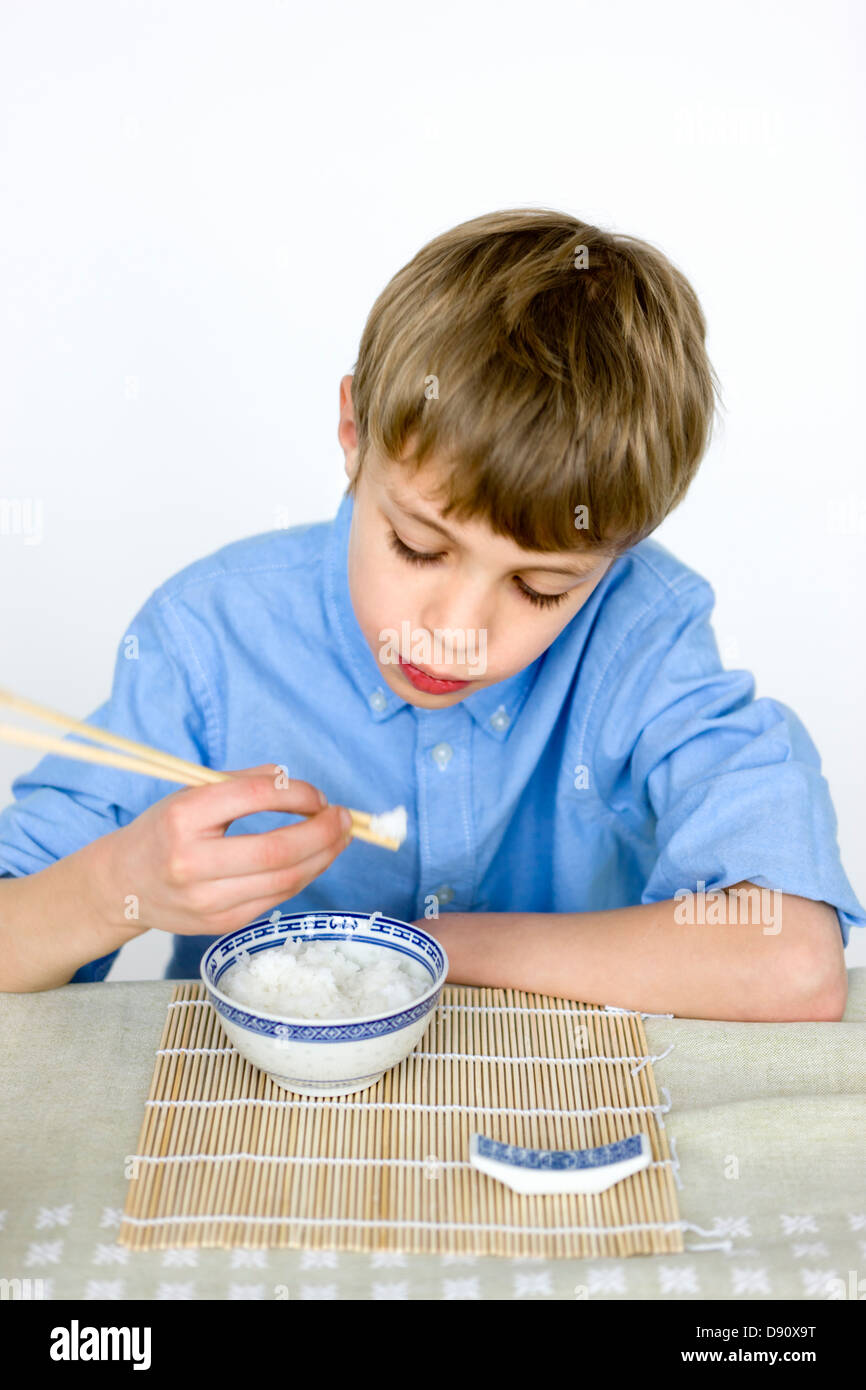 China boy eating chopsticks hi-res stock photography and images - Alamy