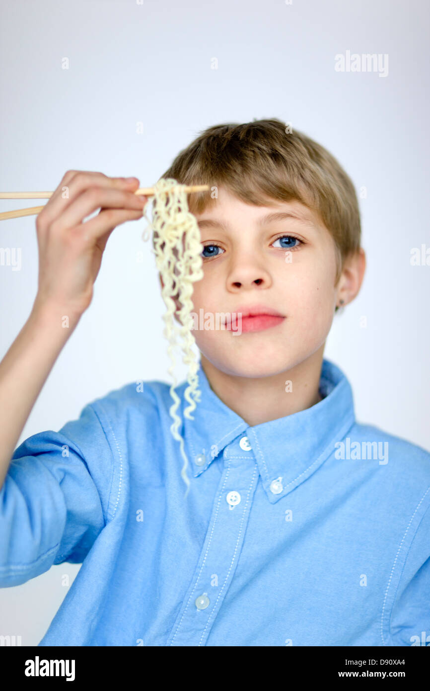 China boy eating chopsticks hi-res stock photography and images - Alamy