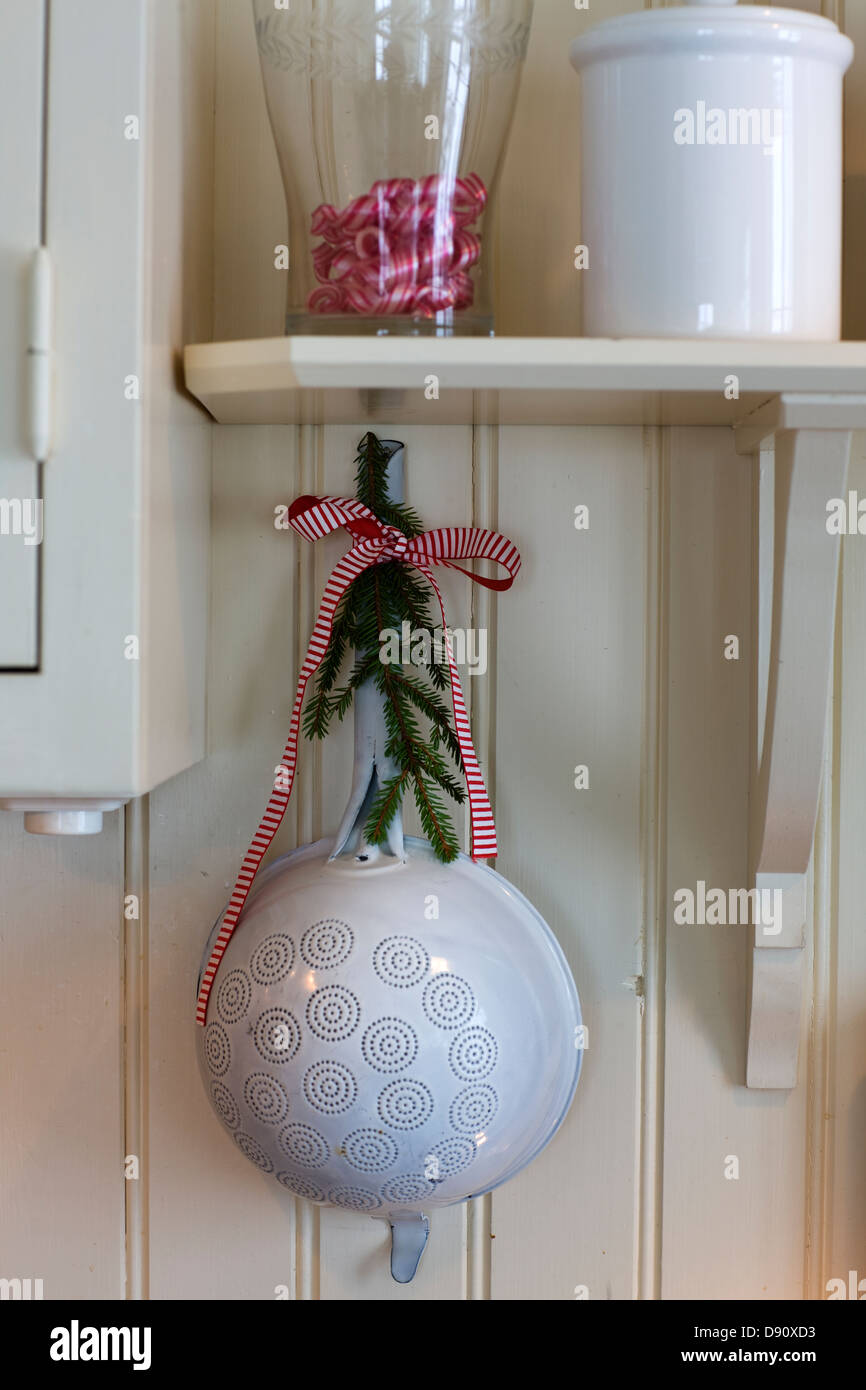 Christmas decoration on colander in kitchen Stock Photo - Alamy
