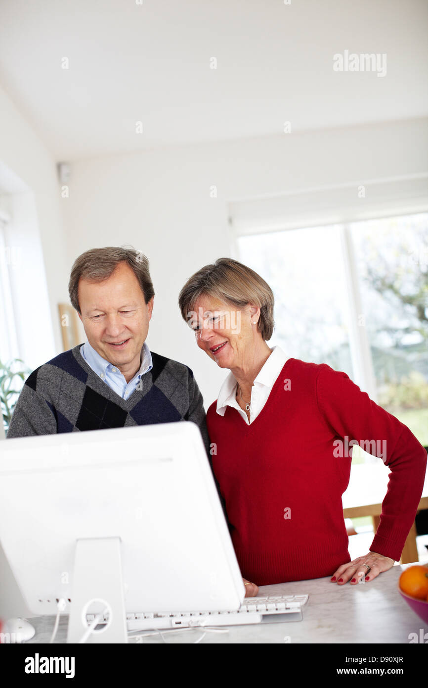 Mature couple using computer Stock Photo - Alamy