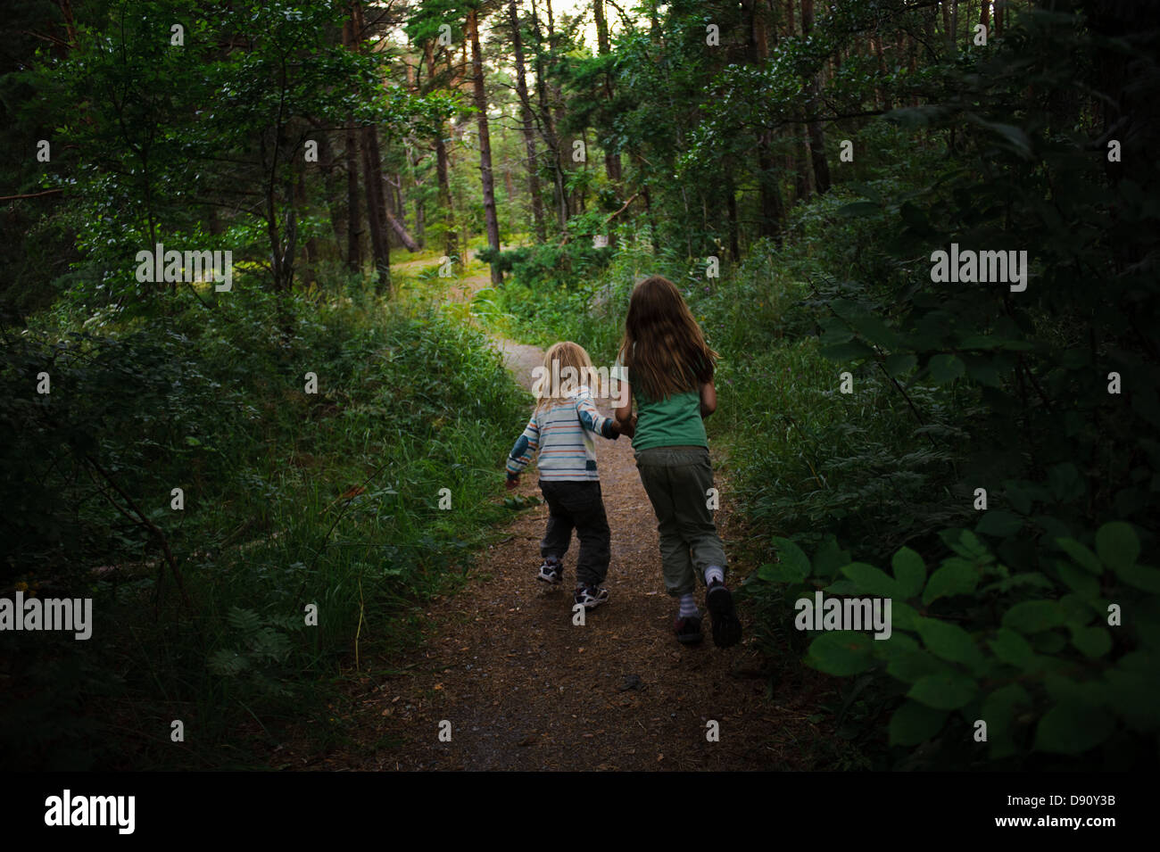 Two girls running through forest hi-res stock photography and images ...