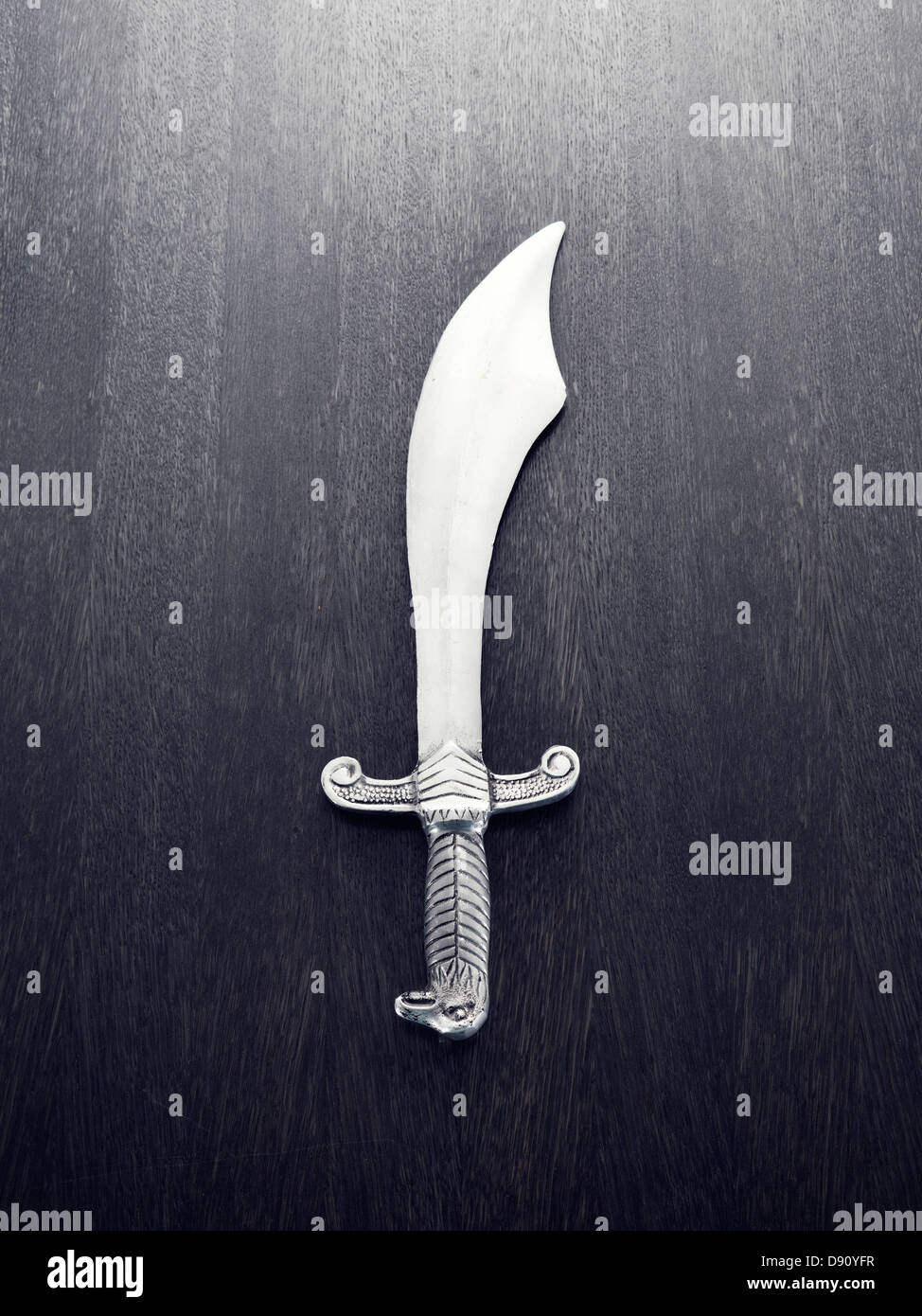 Pirates sword on grey background Stock Photo - Alamy