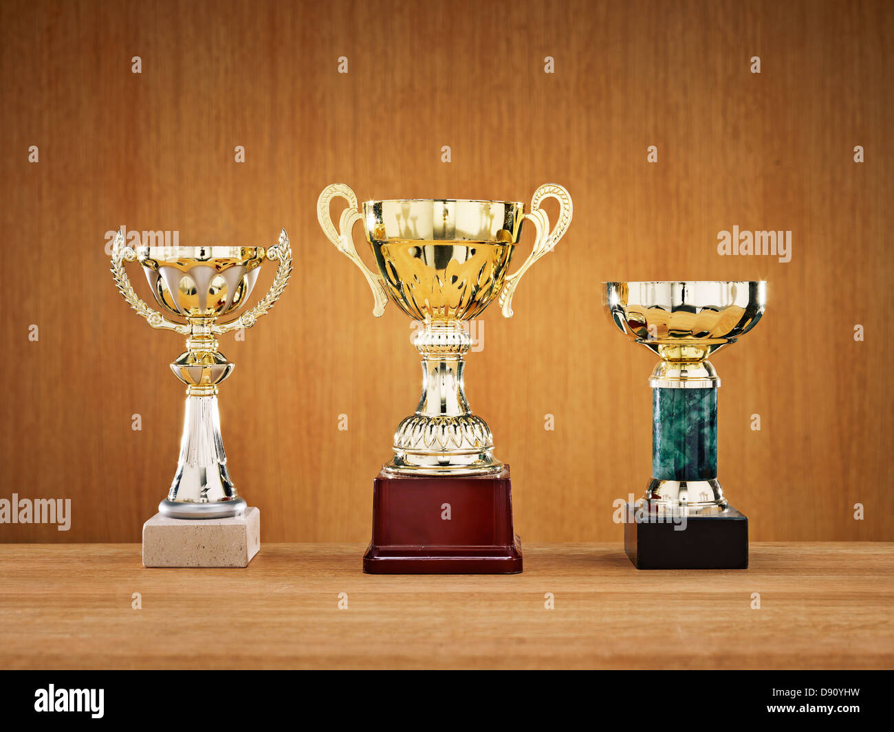 Trophies on wooden background Stock Photo - Alamy