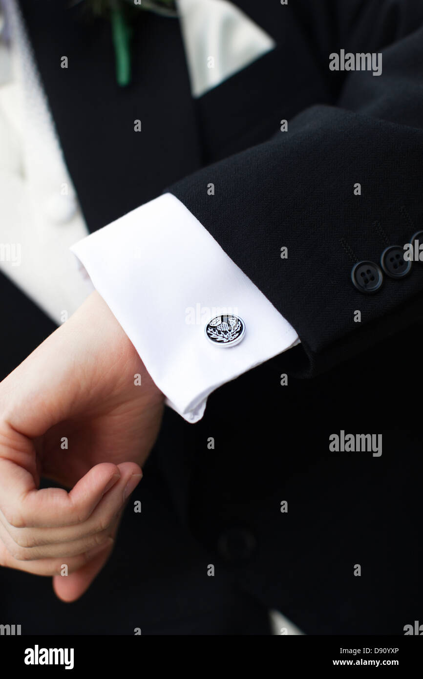 Hand of groom wearing suit and shirt with cuff pins Stock Photo - Alamy