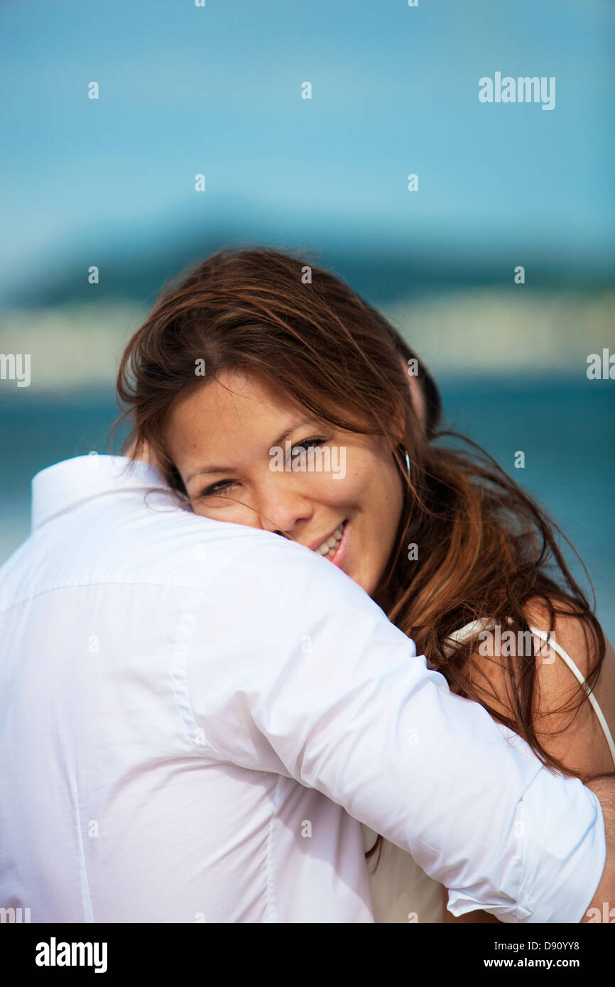 Happy couple embracing Stock Photo - Alamy