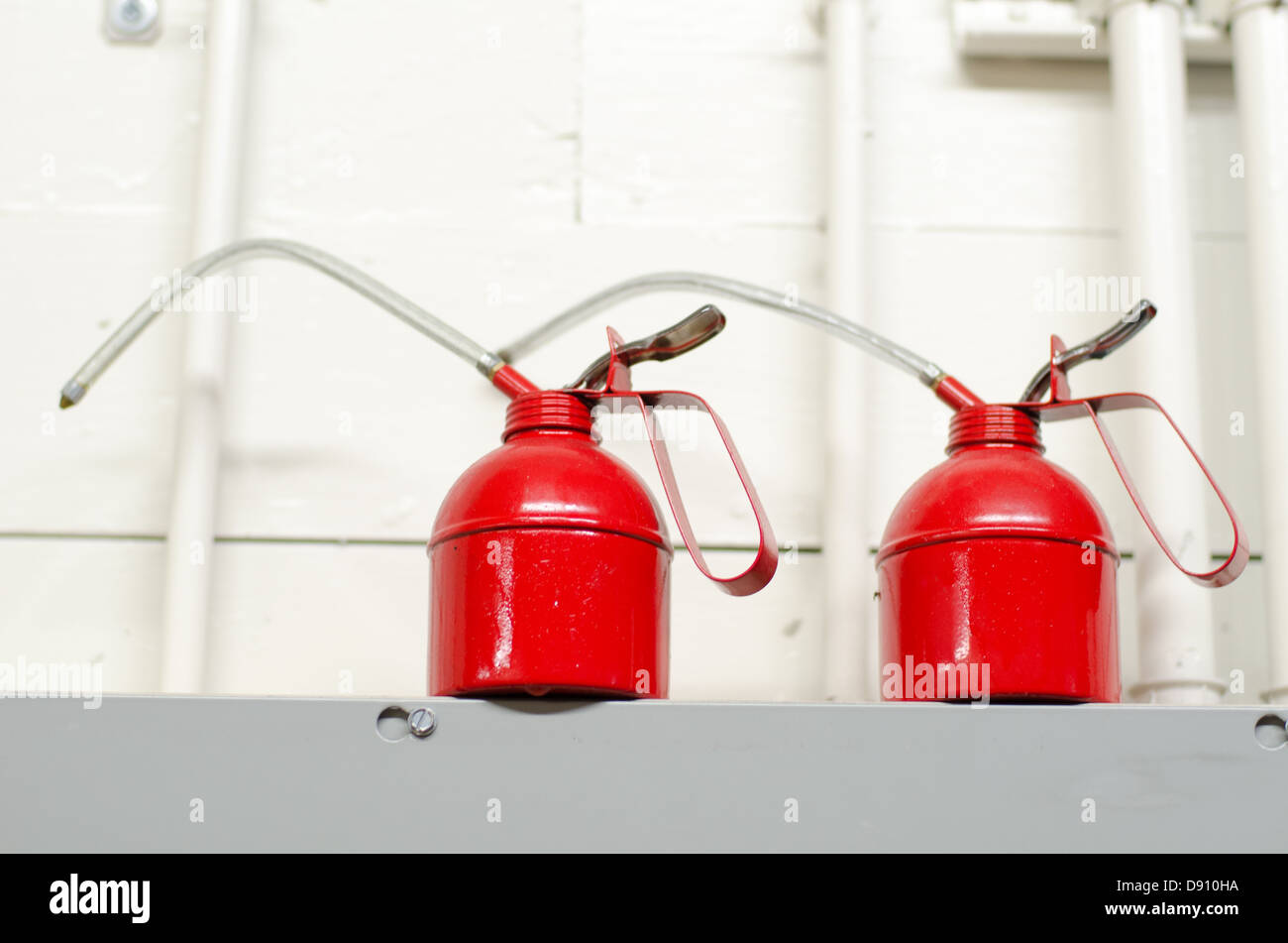 Red oil cans hi-res stock photography and images - Alamy