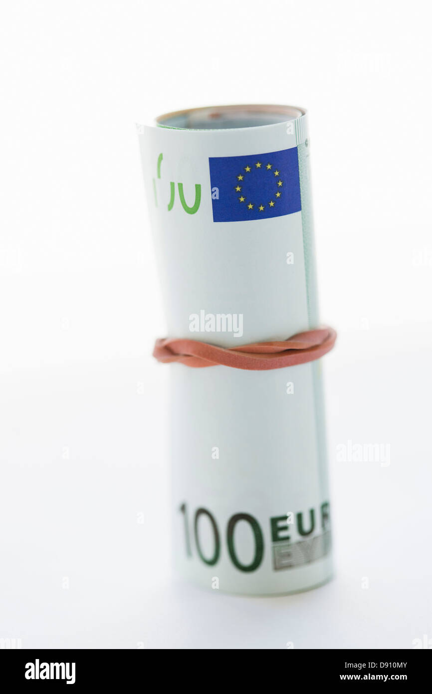 One hundred euro note with rubber band Stock Photo - Alamy