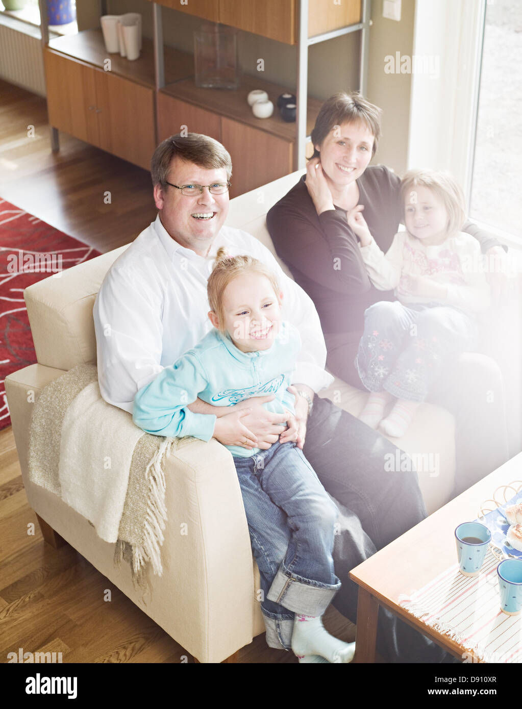 A scandinavian family sitting in a sofa, Sweden Stock Photo - Alamy