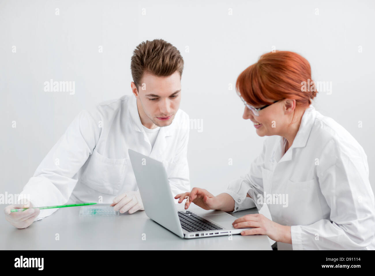 Two scientists working in laboratory Stock Photo - Alamy