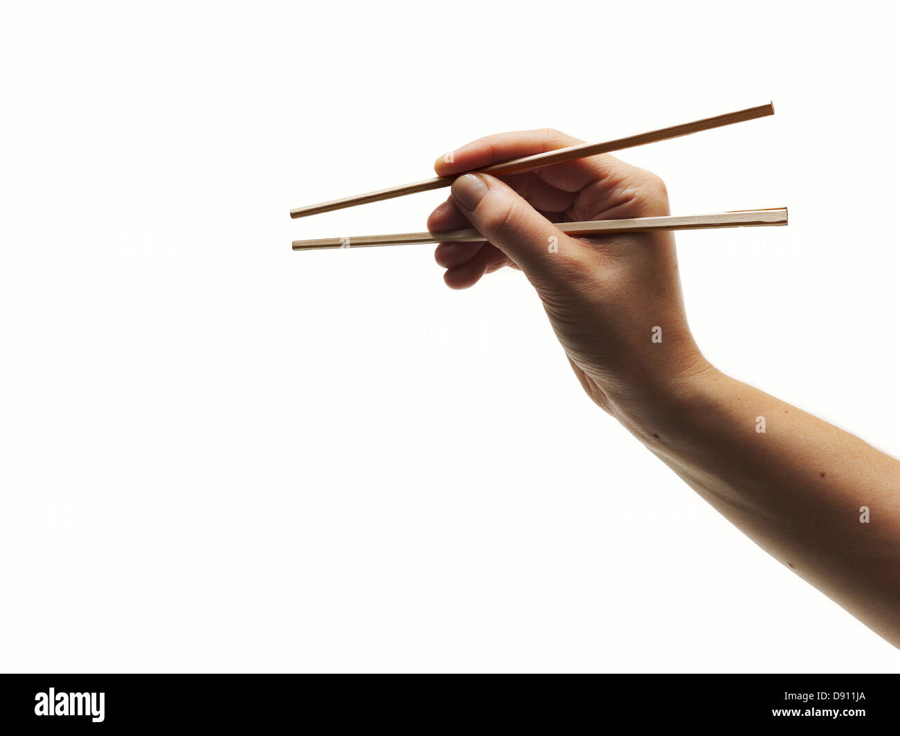 Hand with chopsticks, Sweden Stock Photo - Alamy