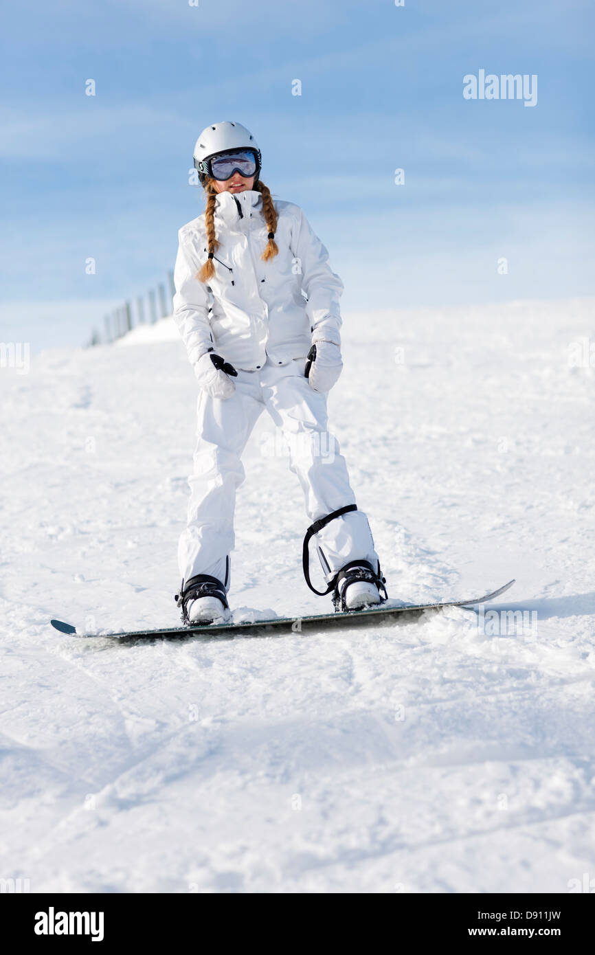 Teenage girl snowboarding Stock Photo - Alamy