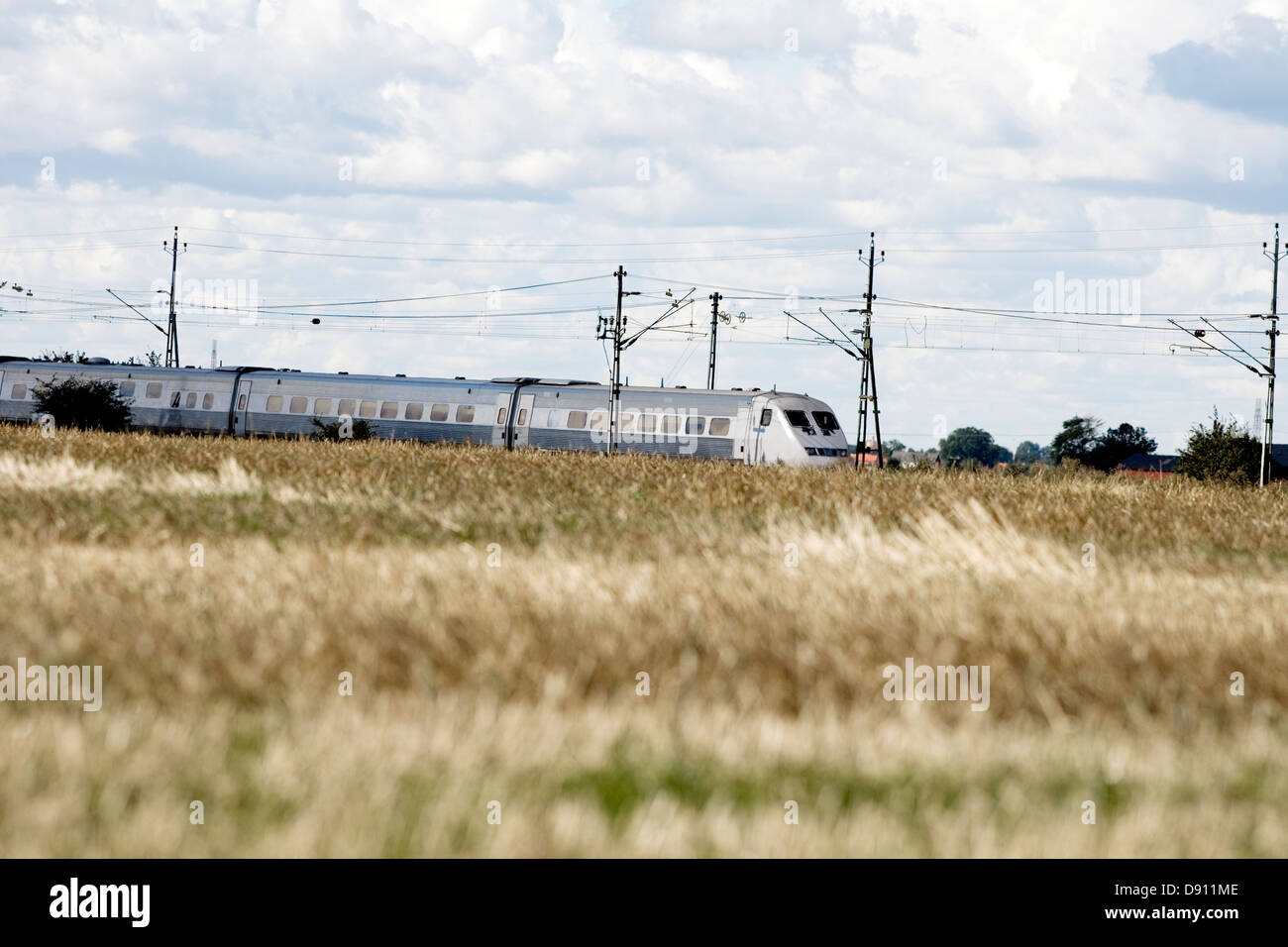 Commuter train on the countryside, Skane, Sweden Stock Photo - Alamy