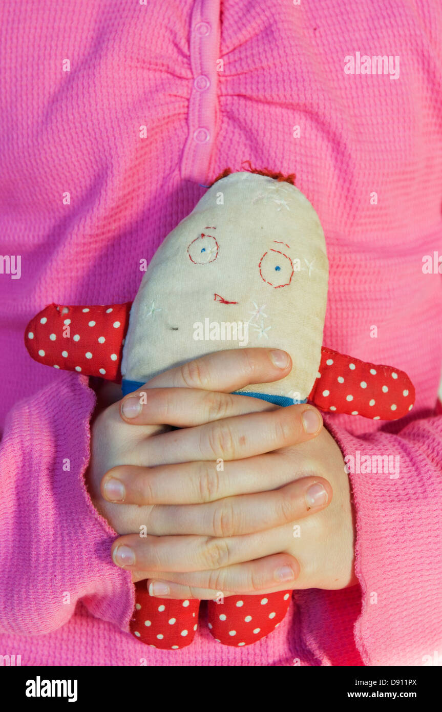 A child holding a rag doll, Sweden Stock Photo - Alamy
