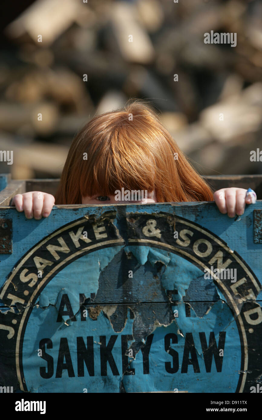 A girl hiding in a box, Sweden Stock Photo - Alamy