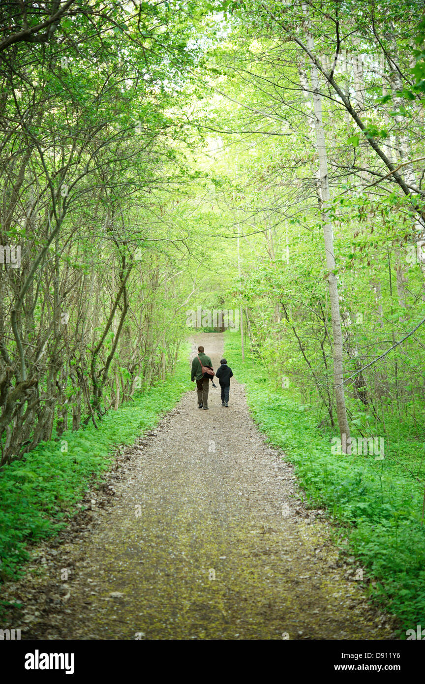 Two people walking through pathway hi-res stock photography and images ...