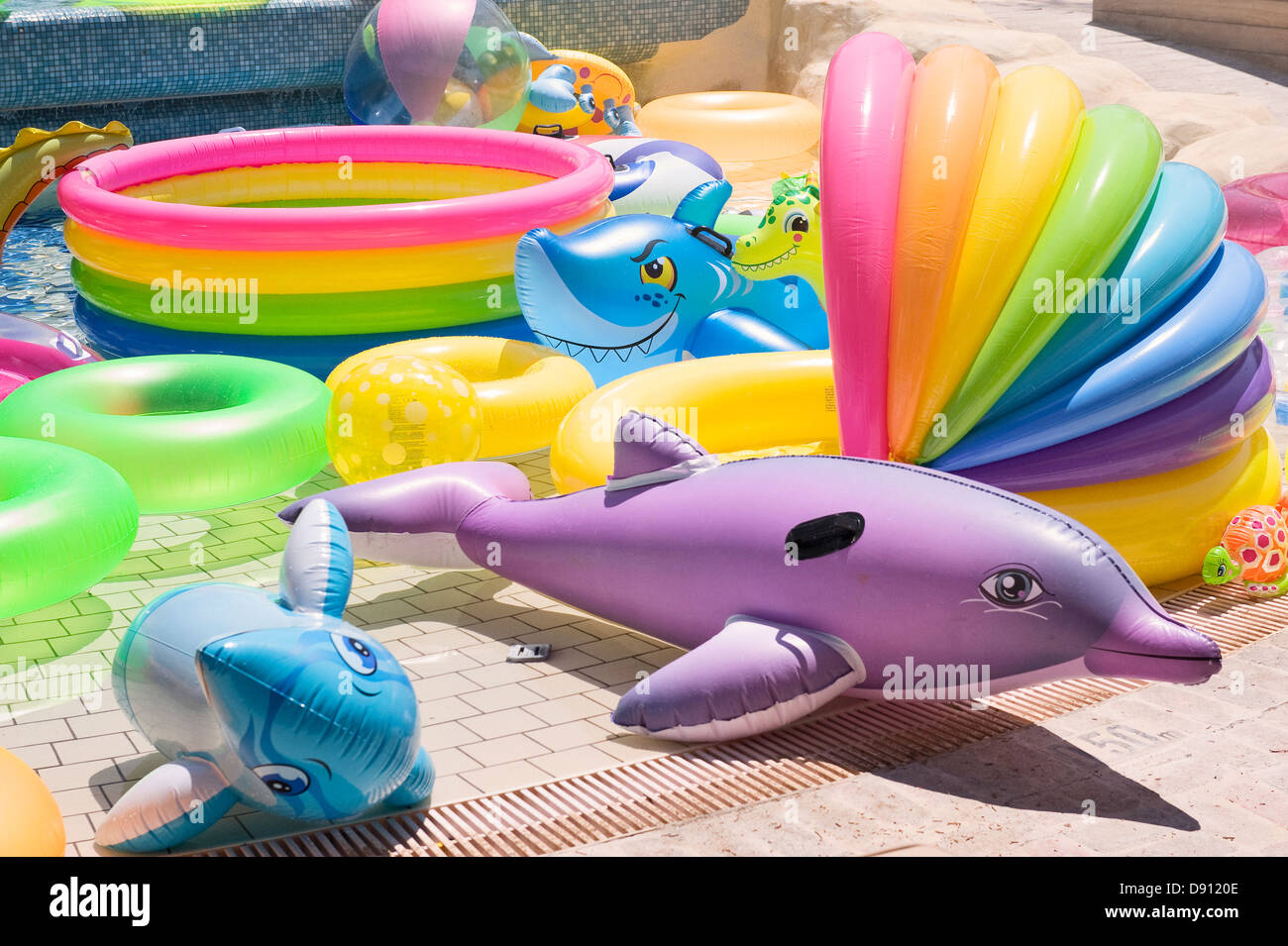 Multicolored inflatable water toys Stock Photo - Alamy