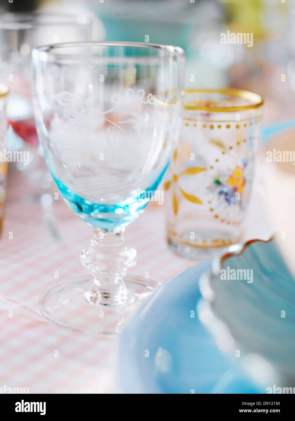 Glasses on a set table, close-up Stock Photo - Alamy