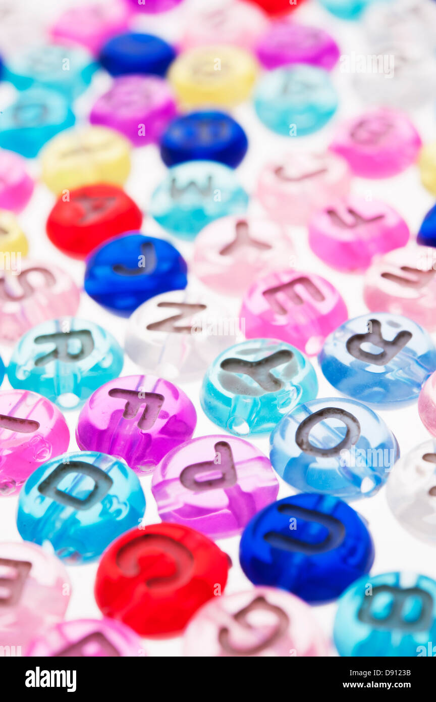 Multicolored letters on white background Stock Photo - Alamy