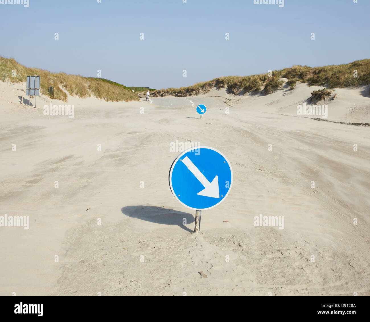 Sandy beach with road sign Stock Photo - Alamy