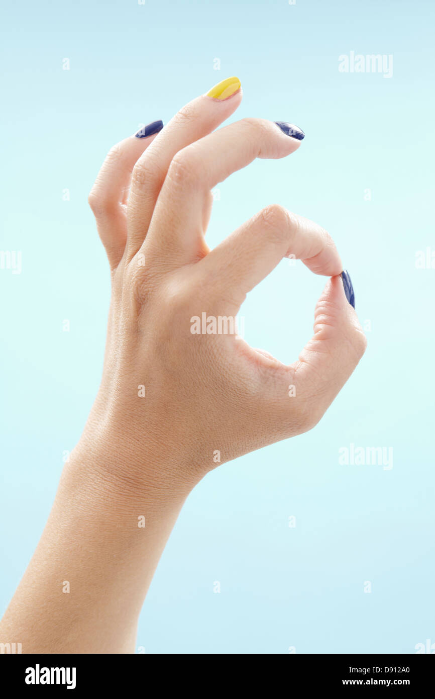 Womans hand making OK sign Stock Photo - Alamy