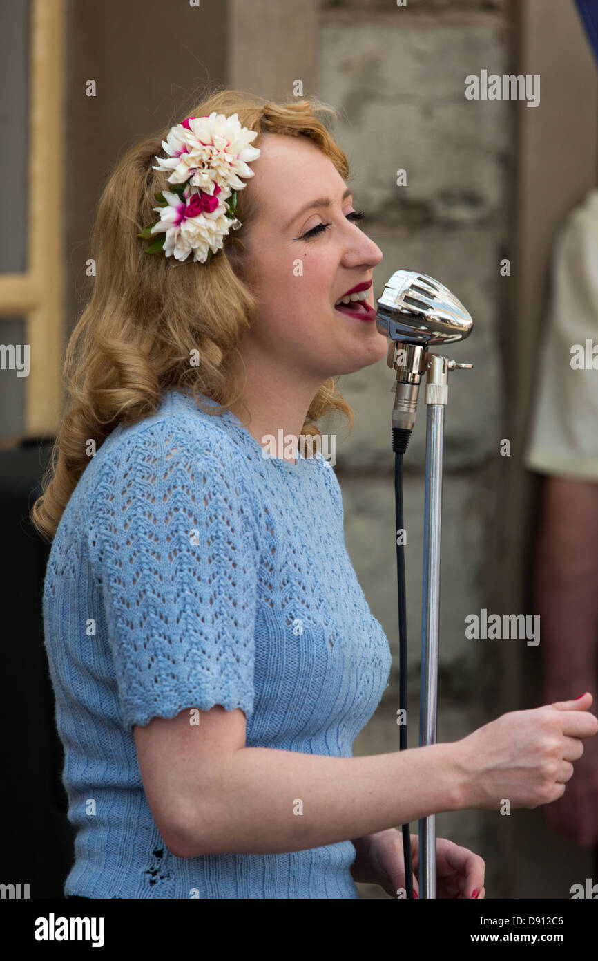 A singer in period dress entertains at Ramsbottom Station during the ...