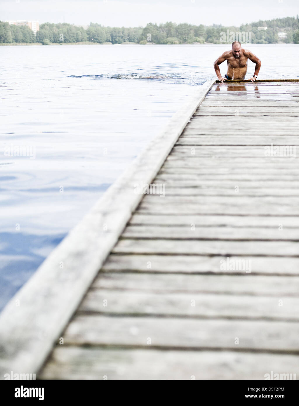 A man on a jetty, Sweden Stock Photo - Alamy