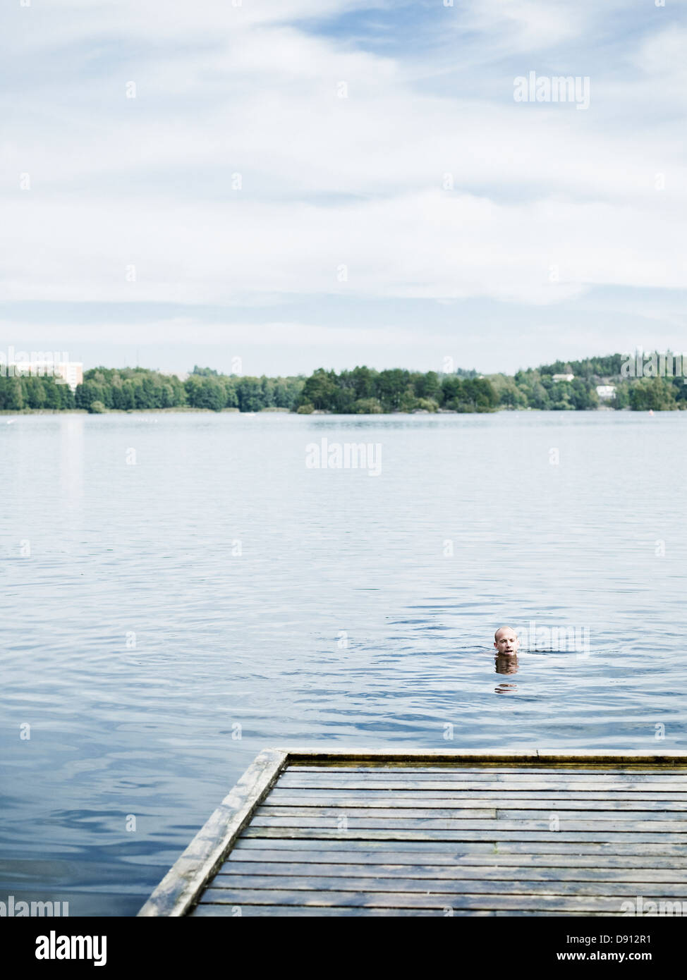 A man swimming in a lake, Sweden Stock Photo - Alamy