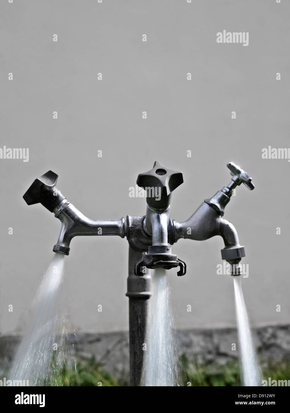 Water taps with running water Stock Photo - Alamy