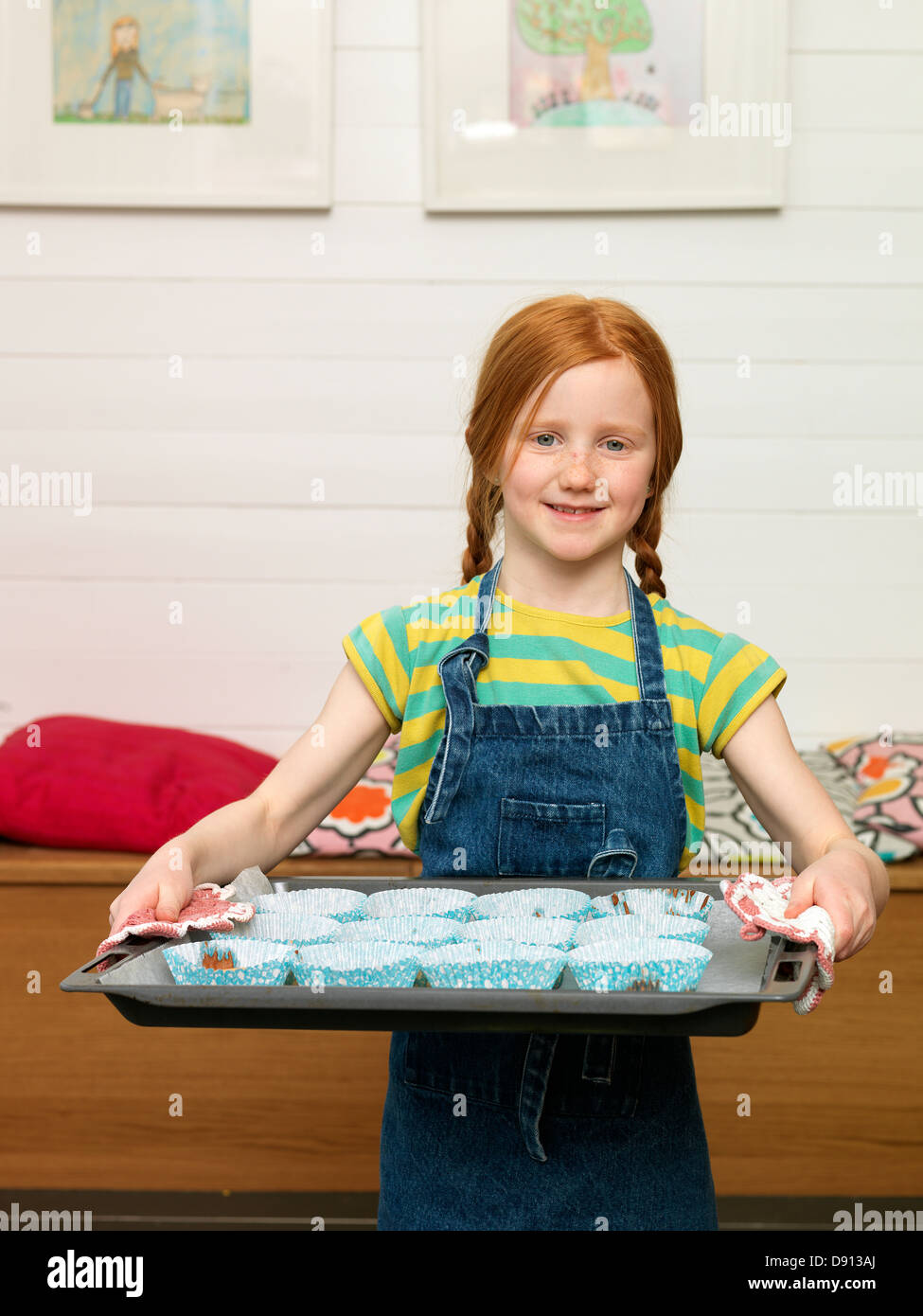 Girl holding tray of cupcakes Stock Photo - Alamy