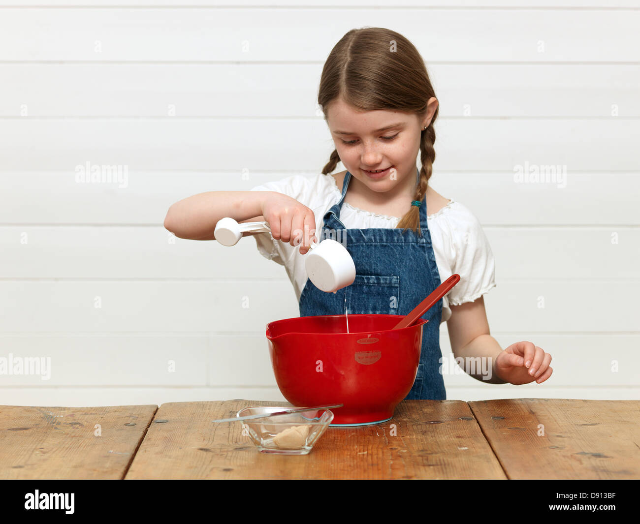 Girl baking cake in kitchen Stock Photo - Alamy