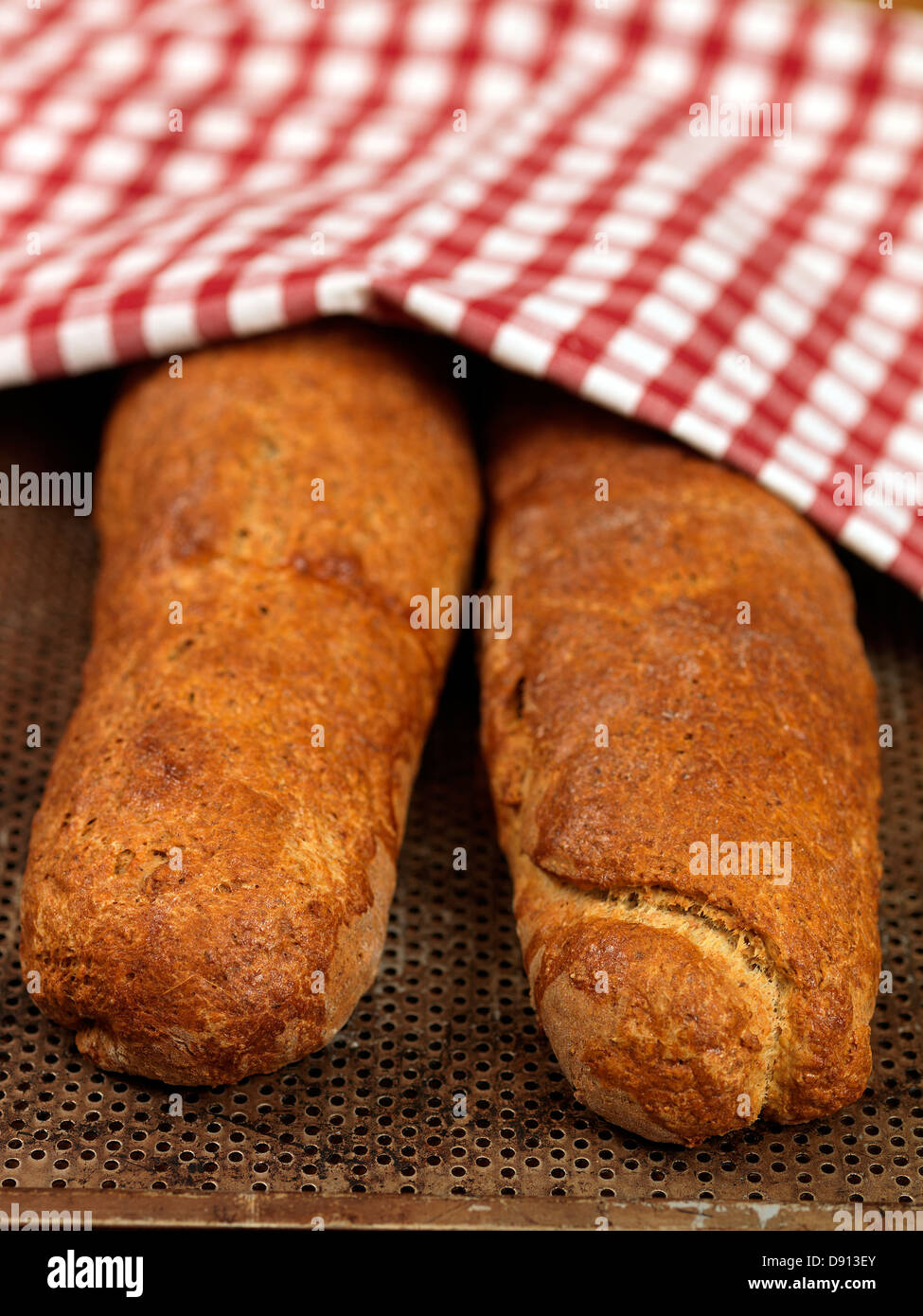 Breads covering with cloth, close-up Stock Photo - Alamy