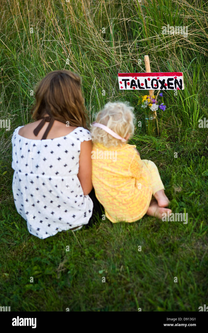 Two sisters mourning by a bird grave, Oland, Sweden Stock Photo - Alamy