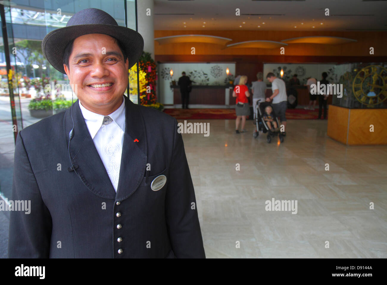 Raffles doorman in singapore hi-res stock photography and images - Alamy