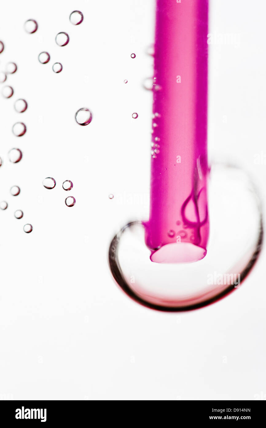 Pink drinking straw in water Stock Photo - Alamy
