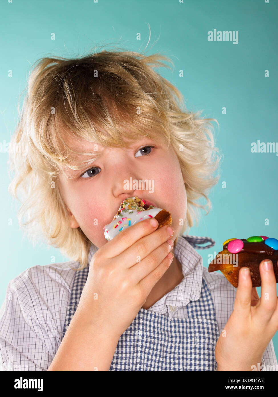 Boy eating muffin hi-res stock photography and images - Alamy