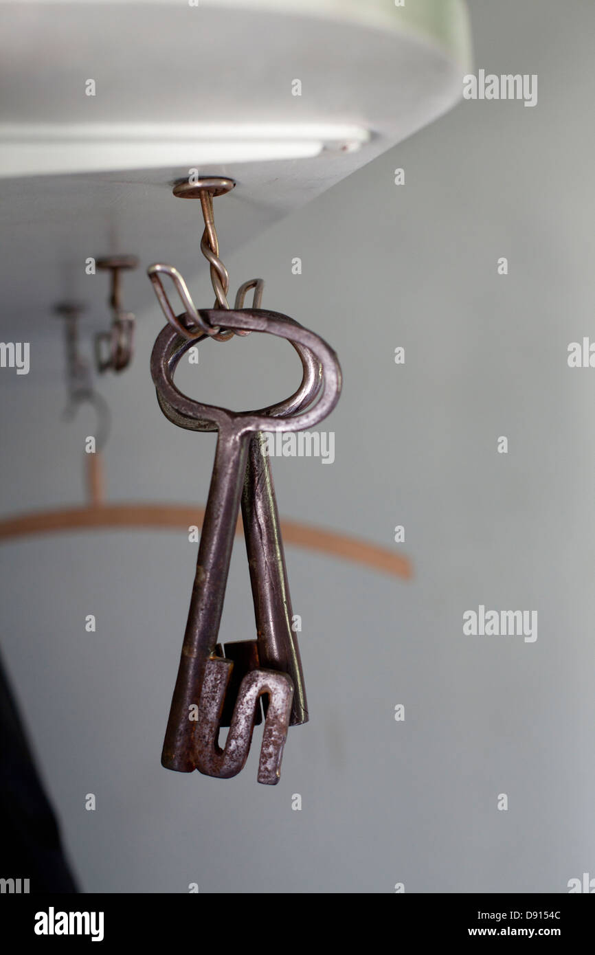 Old keys hanging on hook Stock Photo - Alamy