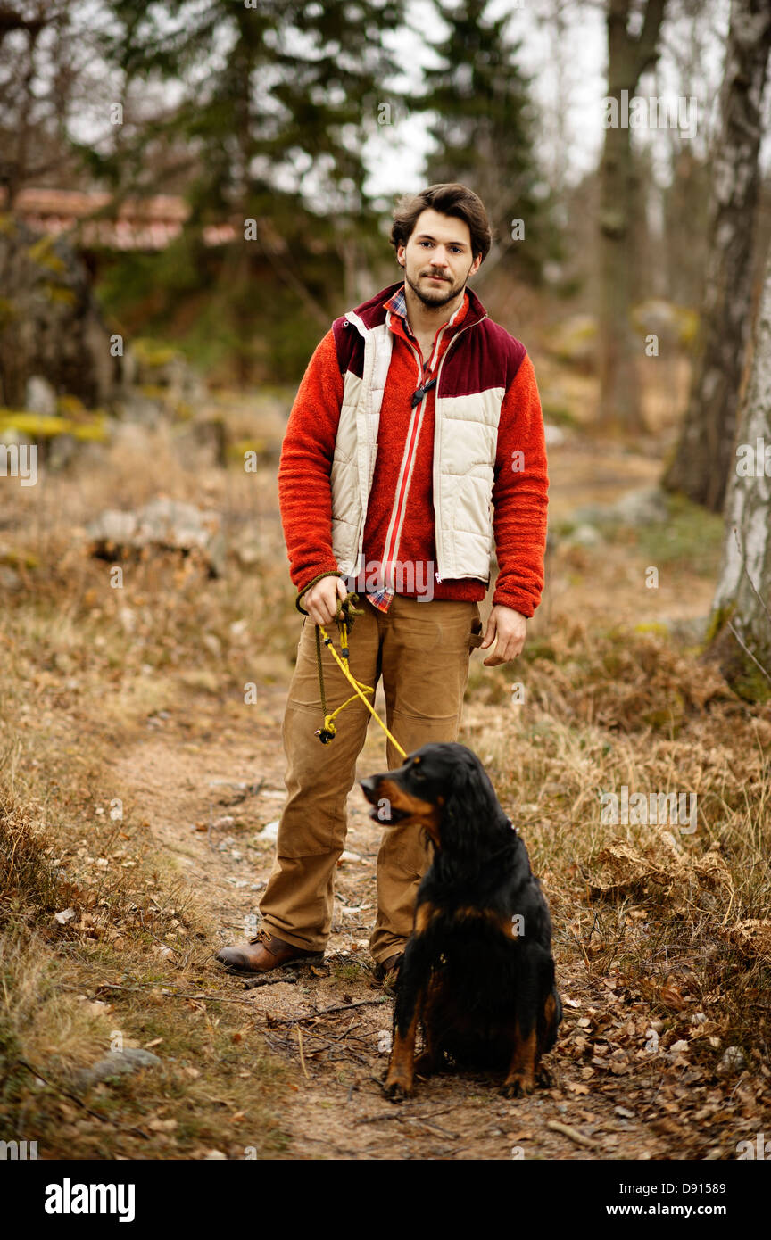 Man walking dog Stock Photo - Alamy