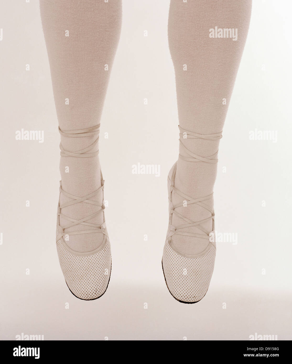 White legs, white shoes against a white wall, Sweden Stock Photo - Alamy